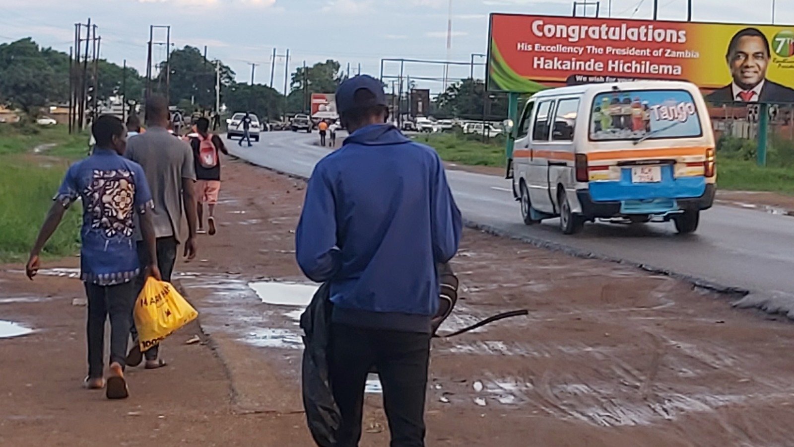Petition update · Bauleni commuters navigate the mud and puddles ...